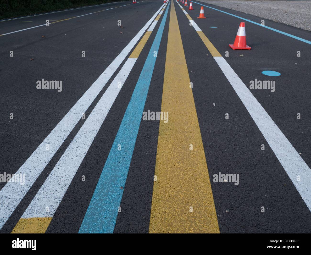 Various lines painted on asphalt. Yellow, blue, white. Part of a ...