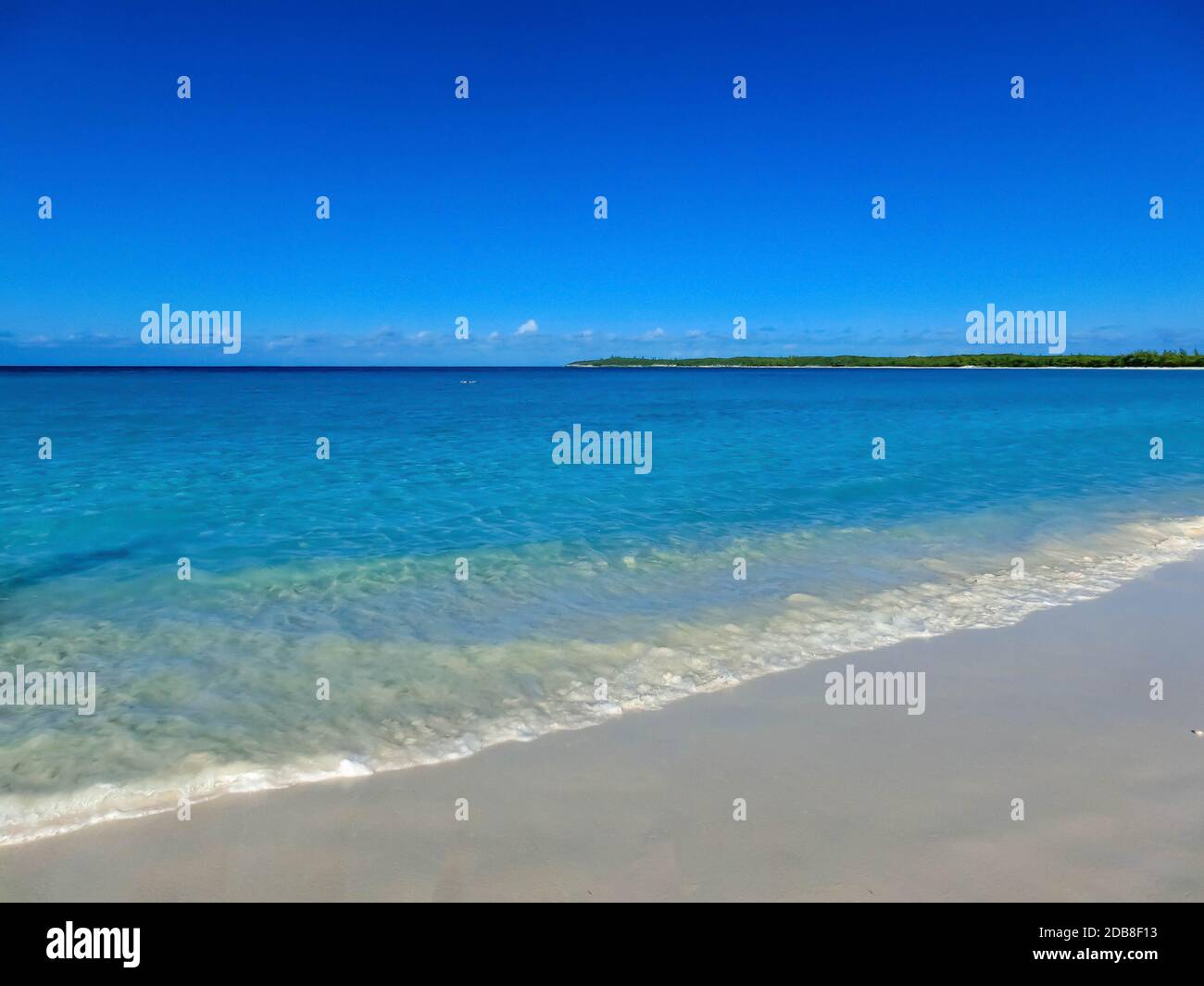 The view of beach on Half Moon Cay island at Bahamas. Blue water and ...