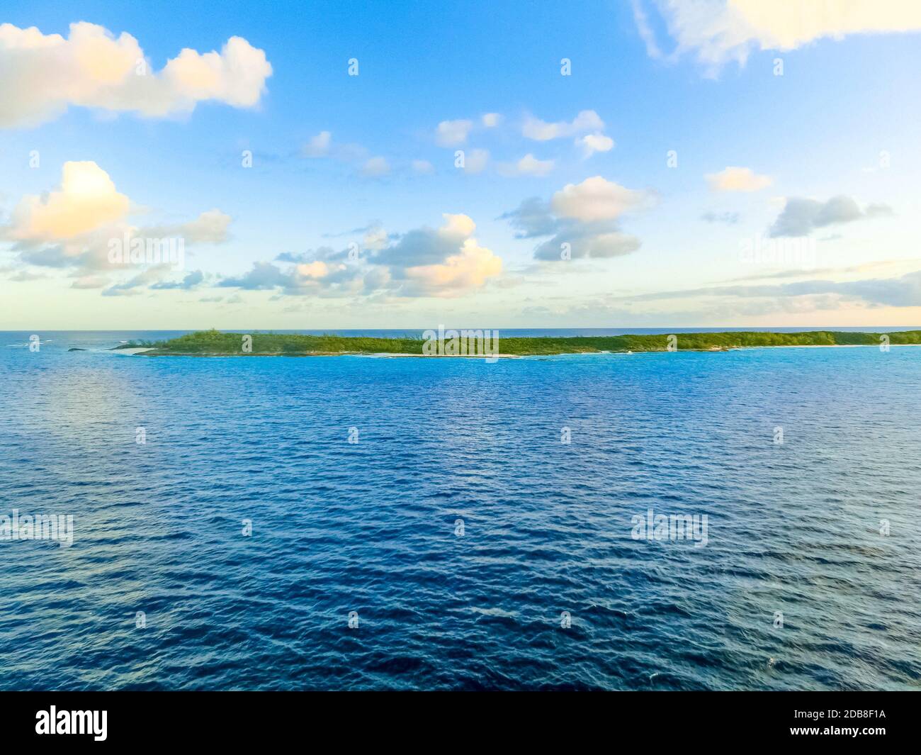The view of beach on Half Moon Cay island at Bahamas. Blue water and ...