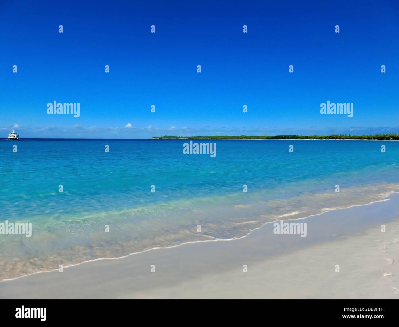 The view of beach on Half Moon Cay island at Bahamas. Blue water and ...
