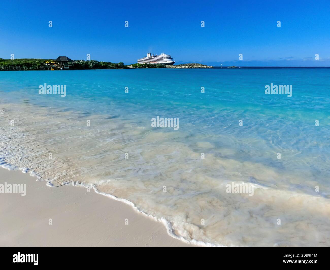 The view of beach on Half Moon Cay island at Bahamas. Blue water and ...