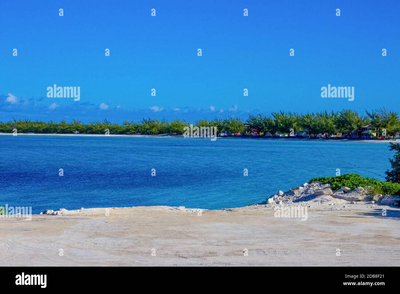 The view of beach on Half Moon Cay island at Bahamas. Blue water and ...