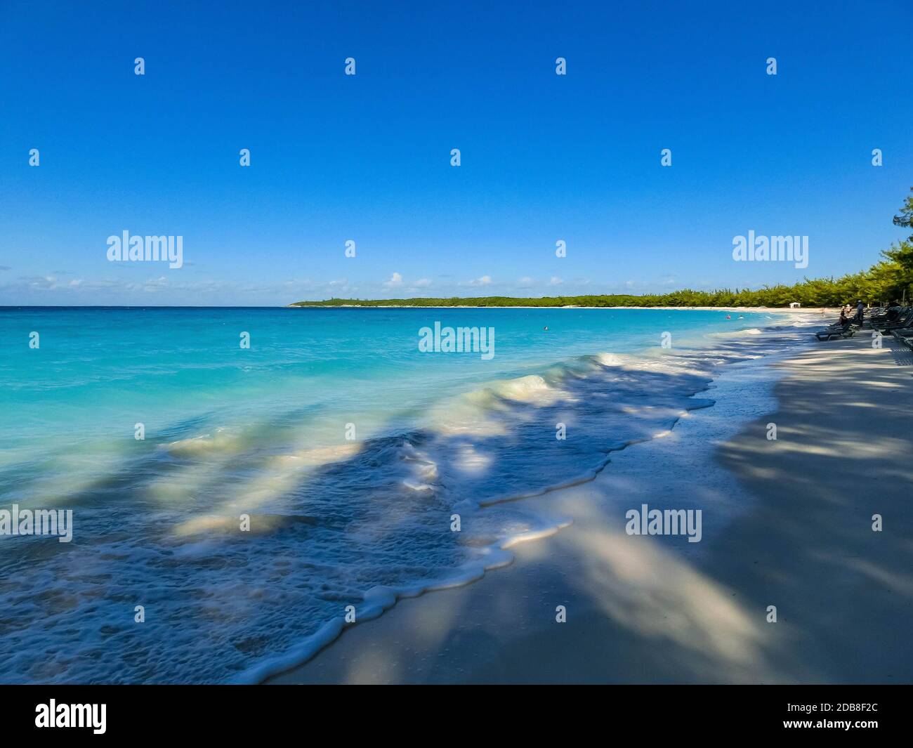 The view of beach on Half Moon Cay island at Bahamas. Blue water and ...