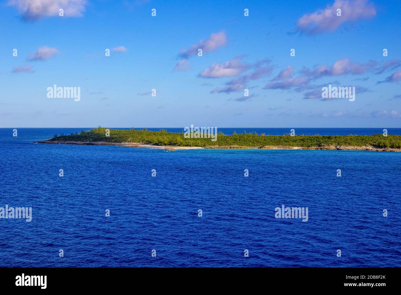 The view of beach on Half Moon Cay island at Bahamas. Blue water and ...