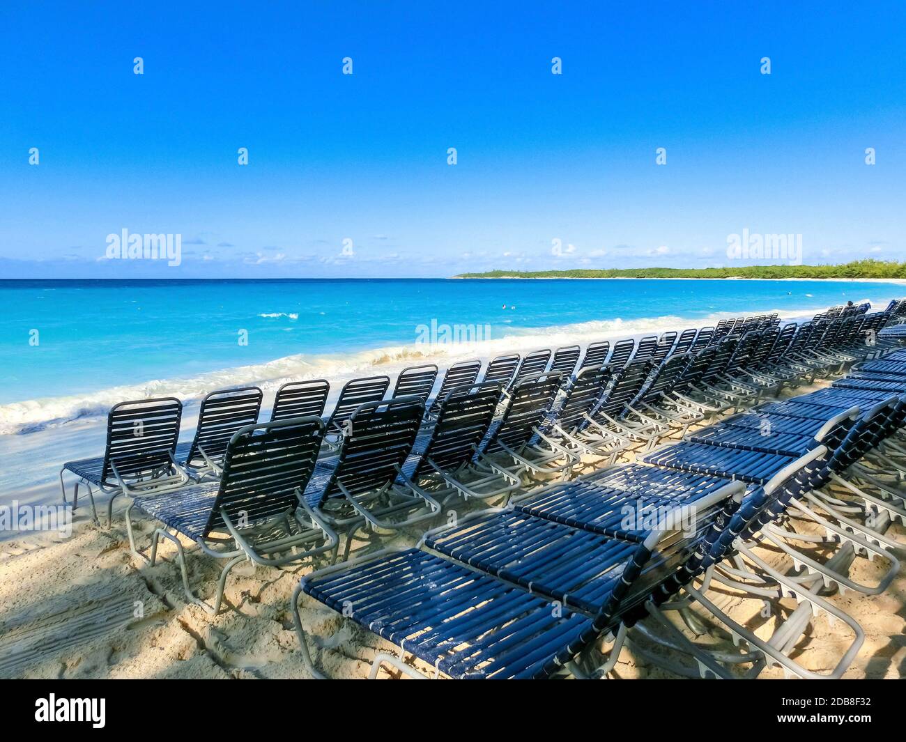The view of empty beach on Half Moon Cay island at Bahamas. Blue water ...