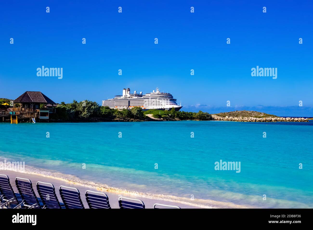 The view of empty beach on Half Moon Cay island at Bahamas. Blue water ...