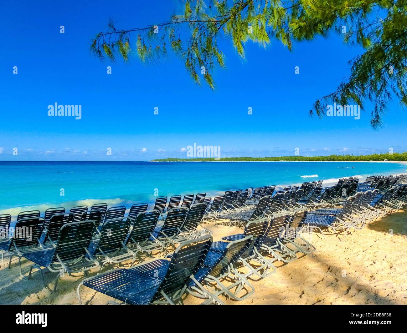The view of empty beach on Half Moon Cay island at Bahamas. Blue water ...