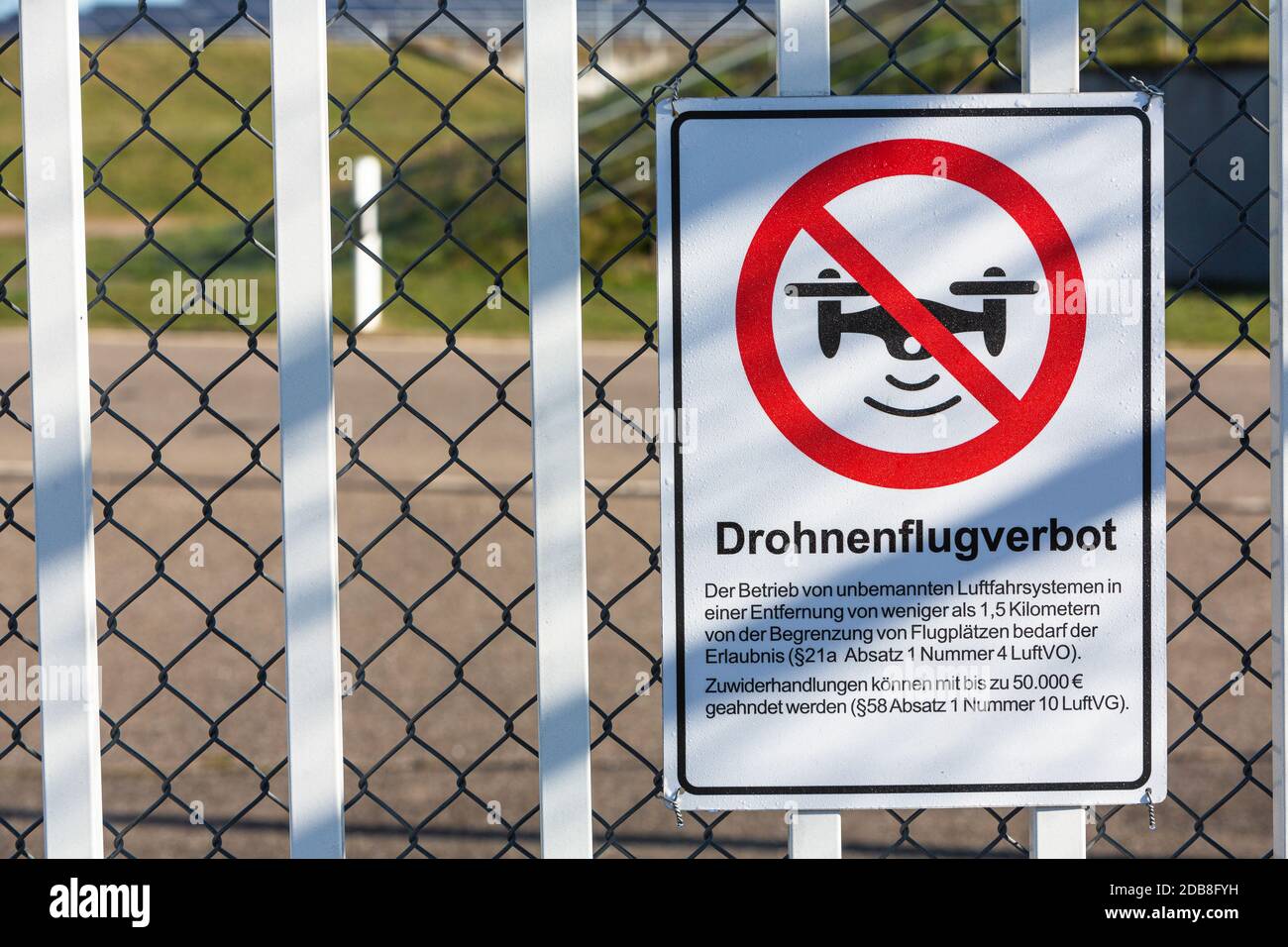 sign with drone fly restrictions on a fence at the airport Stock Photo ...