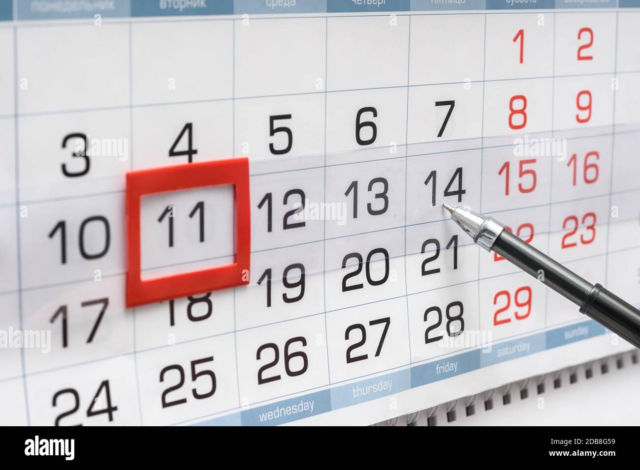 Pen indicates future friday on wall calendar Stock Photo - Alamy