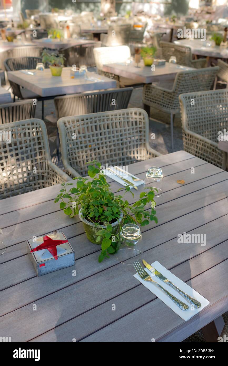 Tables with cover and herbs outdoor in vertical format Stock Photo - Alamy