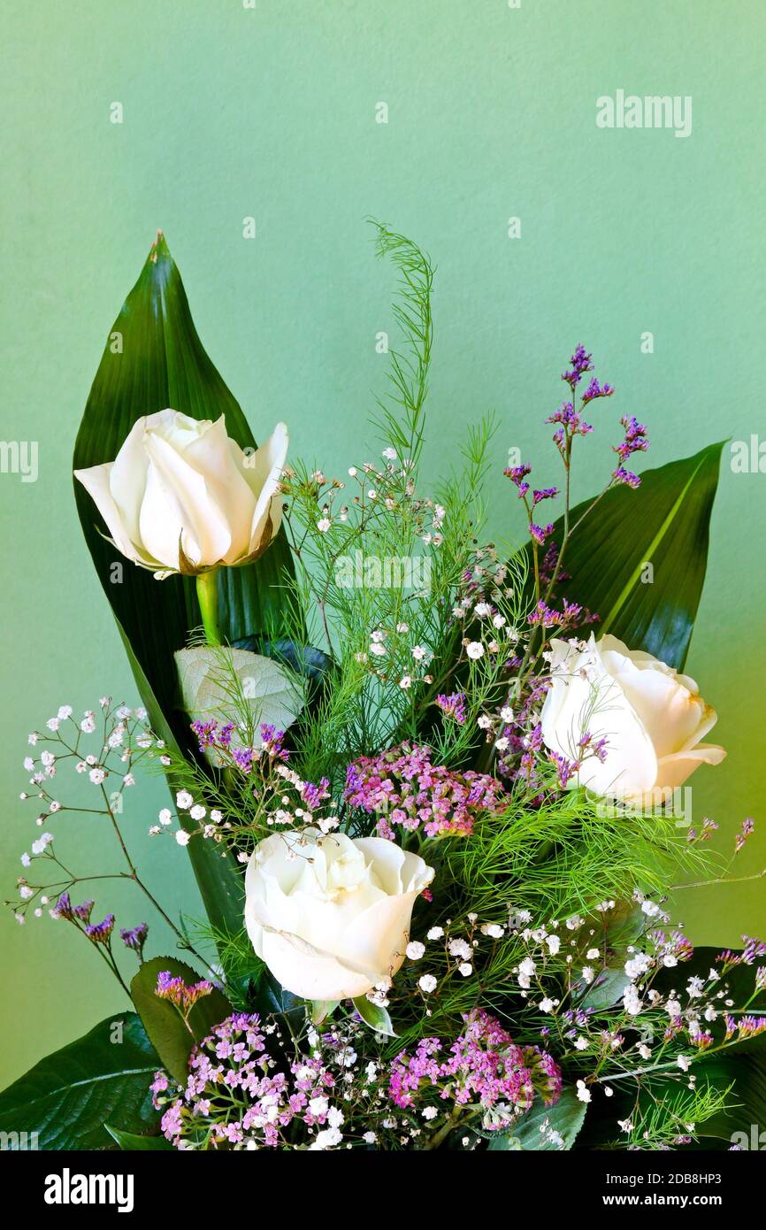 Three white roses in weeding flower bouquet Stock Photo - Alamy