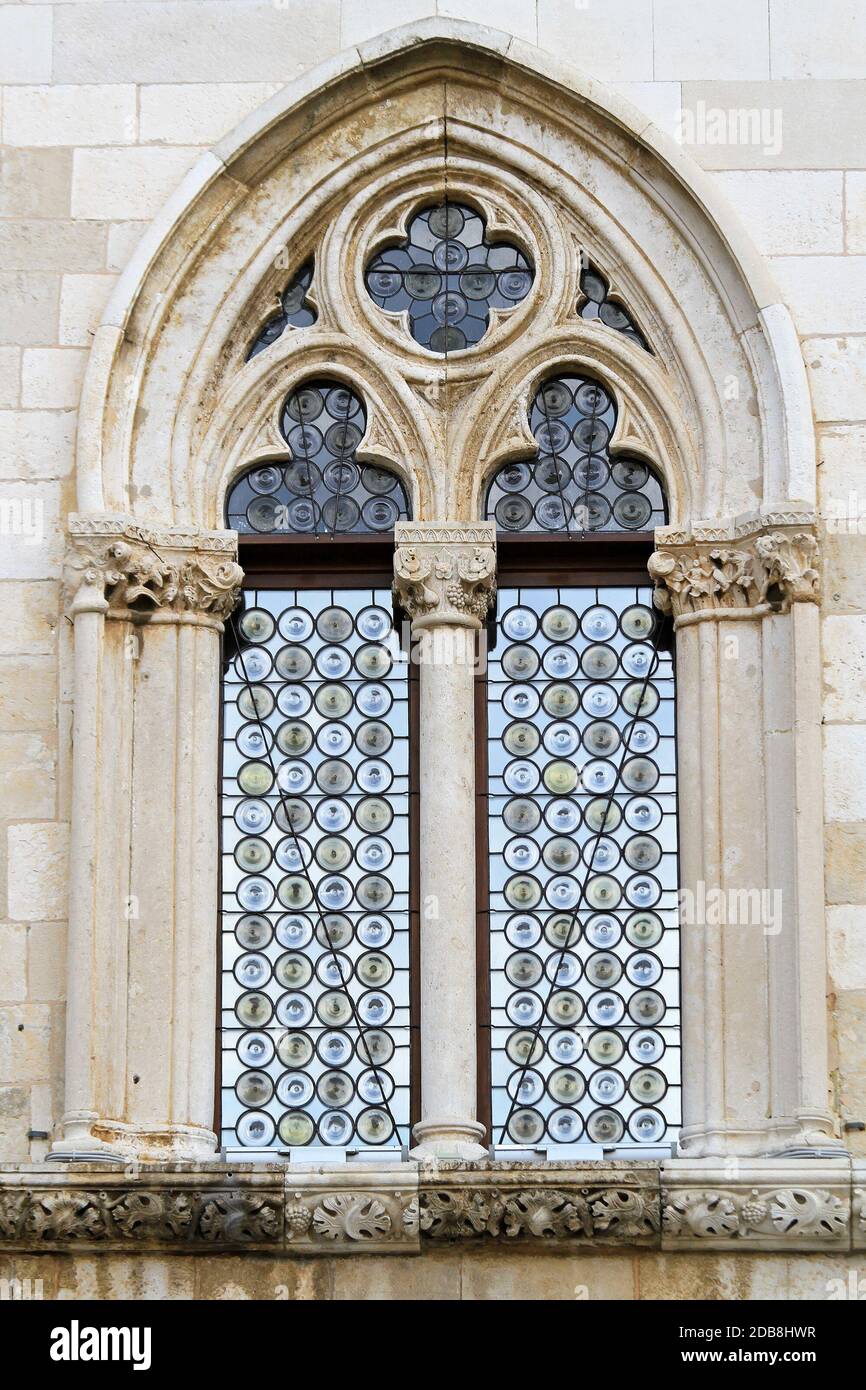 Exterior view of gothic style double window Stock Photo - Alamy