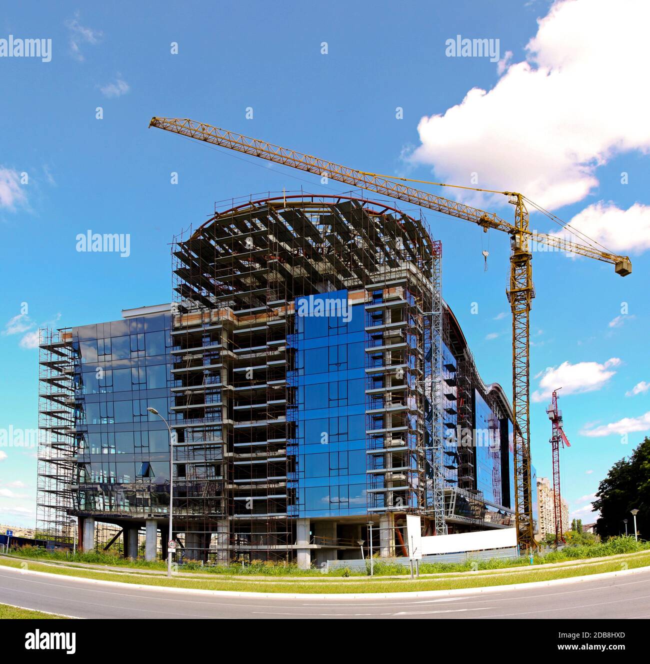 Commercial building with blue windows under construction Stock Photo ...