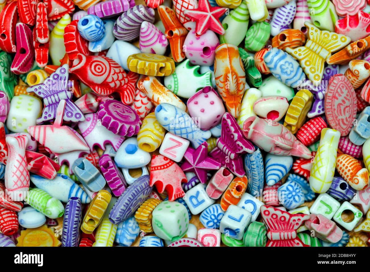 Multi color plastic beads variety assortment background Stock Photo - Alamy