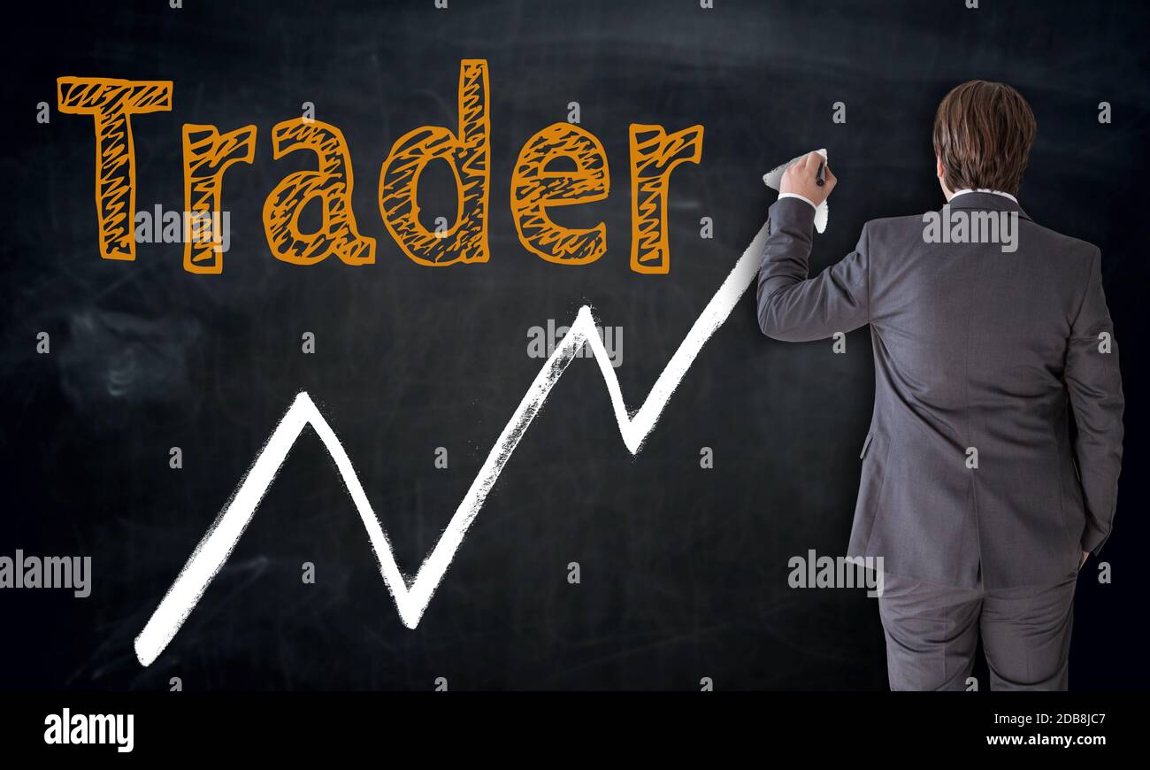 Businessman writing trader on blackboard concept Stock Photo - Alamy