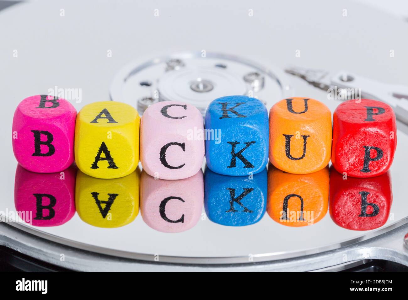 Backup letter cubes on hard disk concept Stock Photo - Alamy