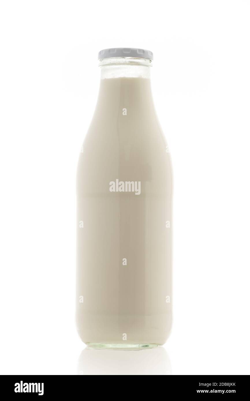 Glass bottle with mild white isolated Stock Photo - Alamy