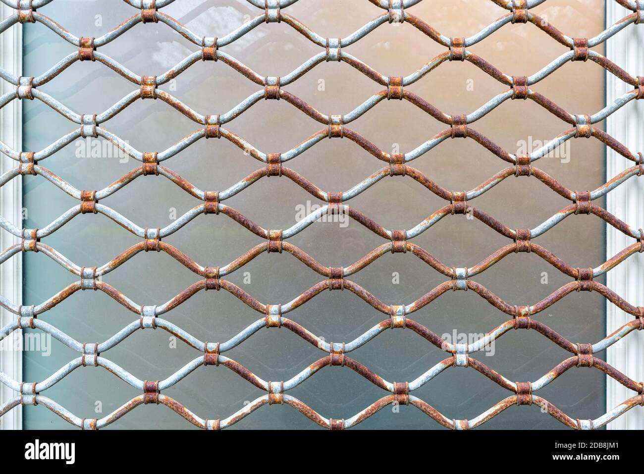 Rusted steel security grill on a shop window Stock Photo - Alamy