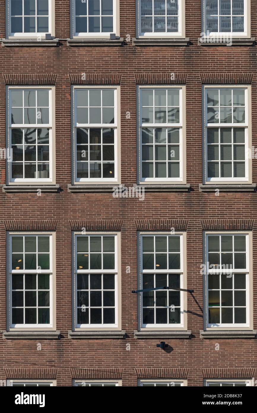 Windows at Brown Bricks Building in Amsterdam Stock Photo - Alamy