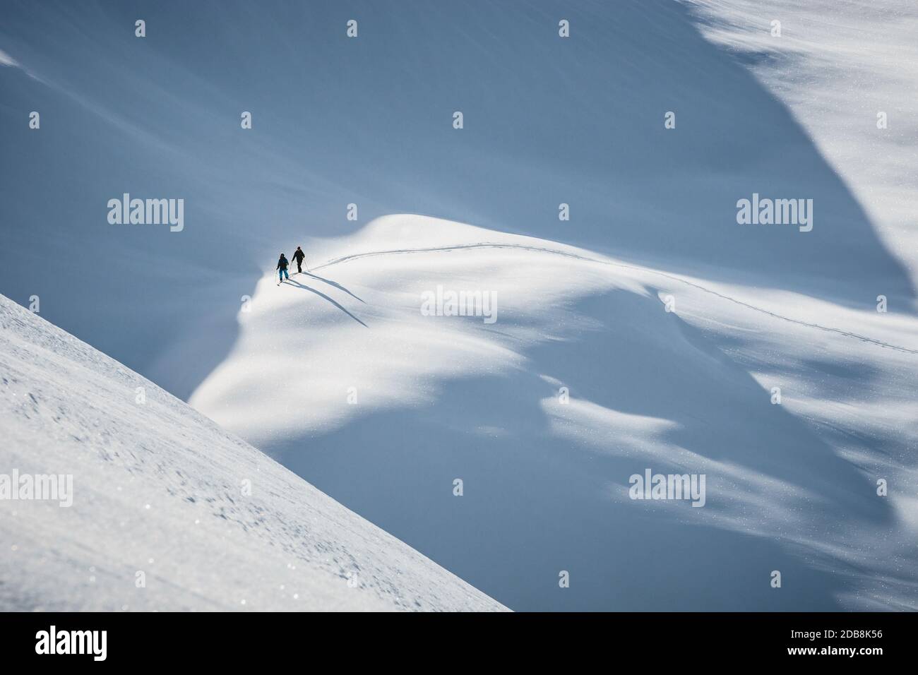 Two people skiing in the Alps, Lienz, Austria Stock Photo - Alamy