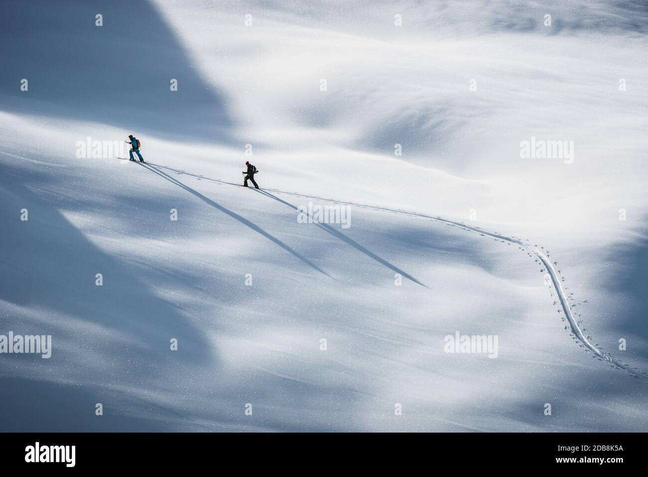 Two people skiing in the Alps, Lienz, Austria Stock Photo - Alamy