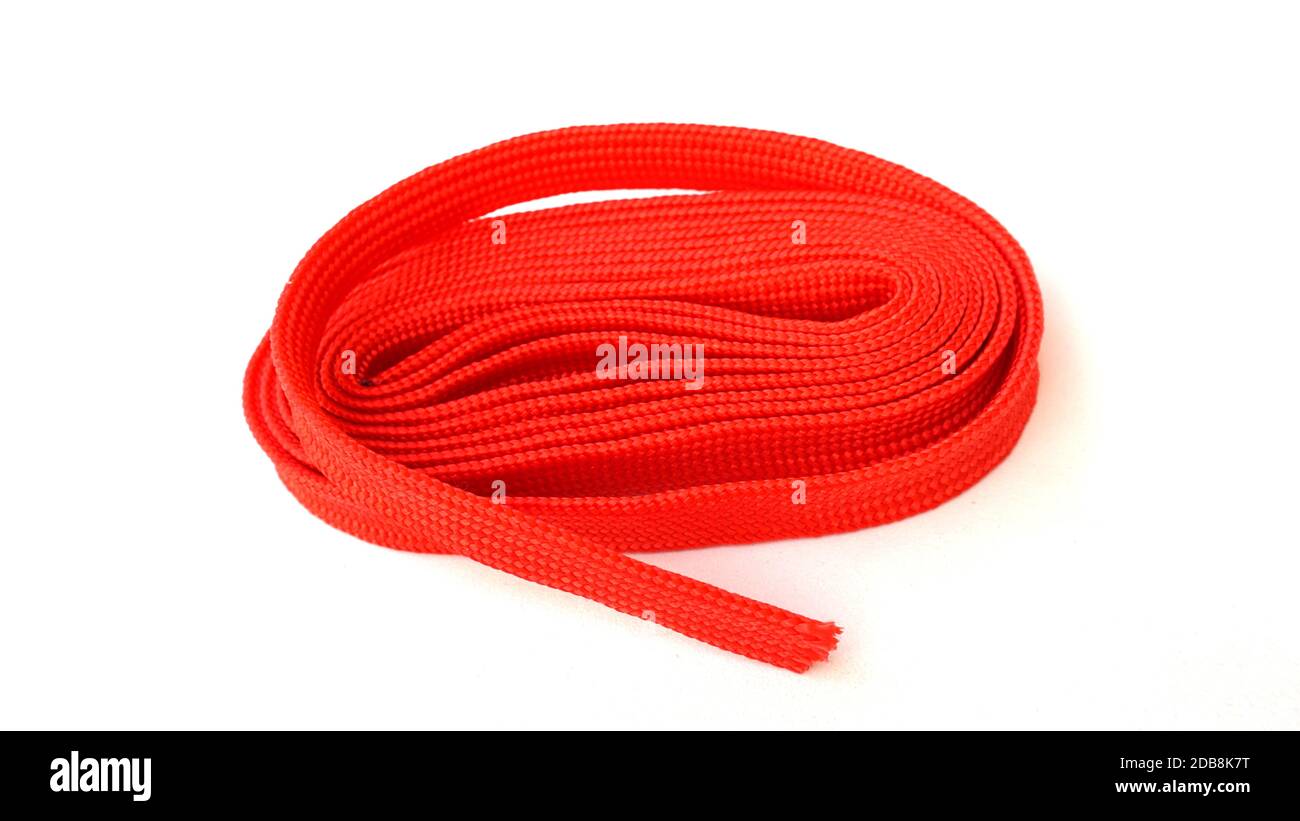 Red rope on white background. Fabric rope in red color folded in a coil ...