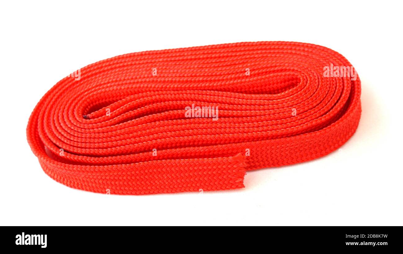 Red rope on white background. Fabric rope in red color folded in a coil ...