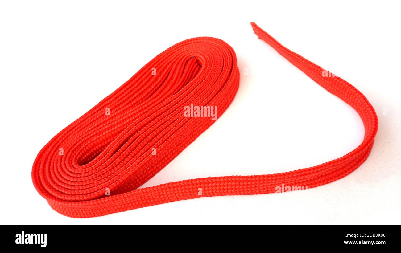 Red rope on white background. Fabric rope in red color folded in a coil ...