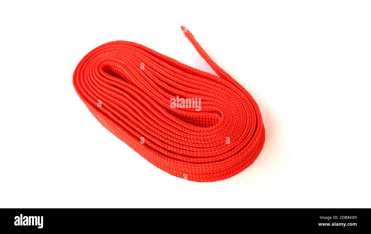 Red rope on white background. Fabric rope in red color folded in a coil ...