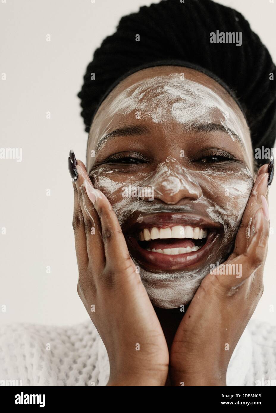 Portrait of a smiling woman with a face mask Stock Photo - Alamy
