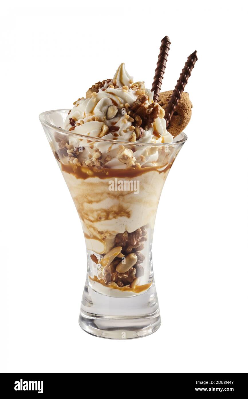 Gourmet ice cream sundae with mixed nuts and syrup garnished with ...