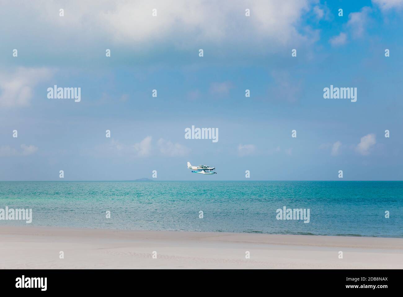 Seaplane flying above the ocean in Australia Stock Photo - Alamy