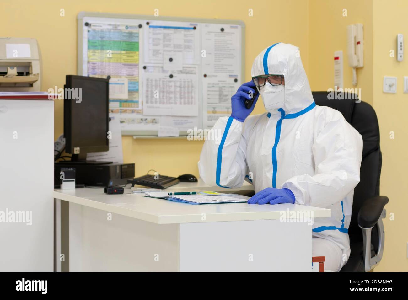 Male nurse with protective coverall clothing in intensive care unit ...