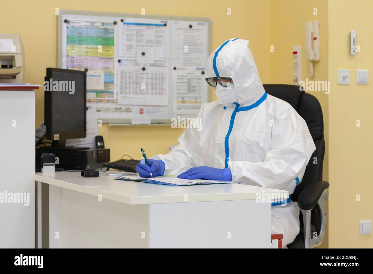 Male nurse with protective coverall clothing in intensive care unit ...