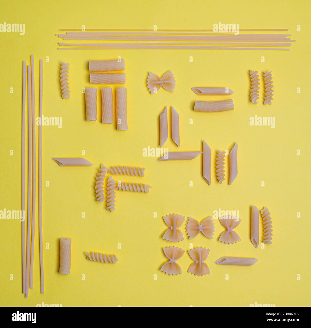 top view of some types of pasta arranged on a colored surface Stock ...