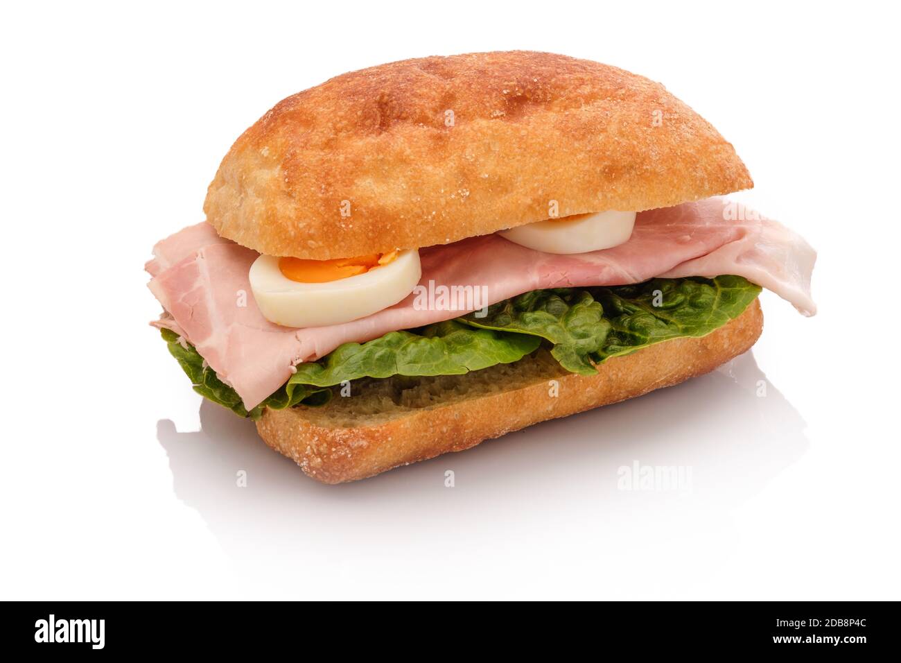 Roll sandwich with boiled ham an hard cooked egg white isolated Stock ...