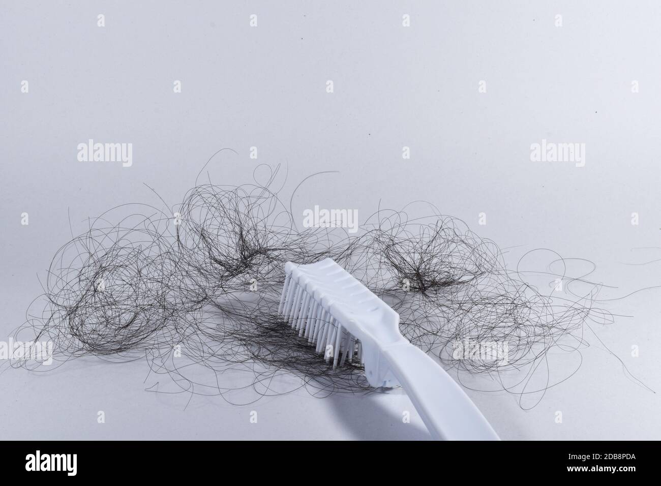 Bad combing causes hair damage Stock Photo - Alamy