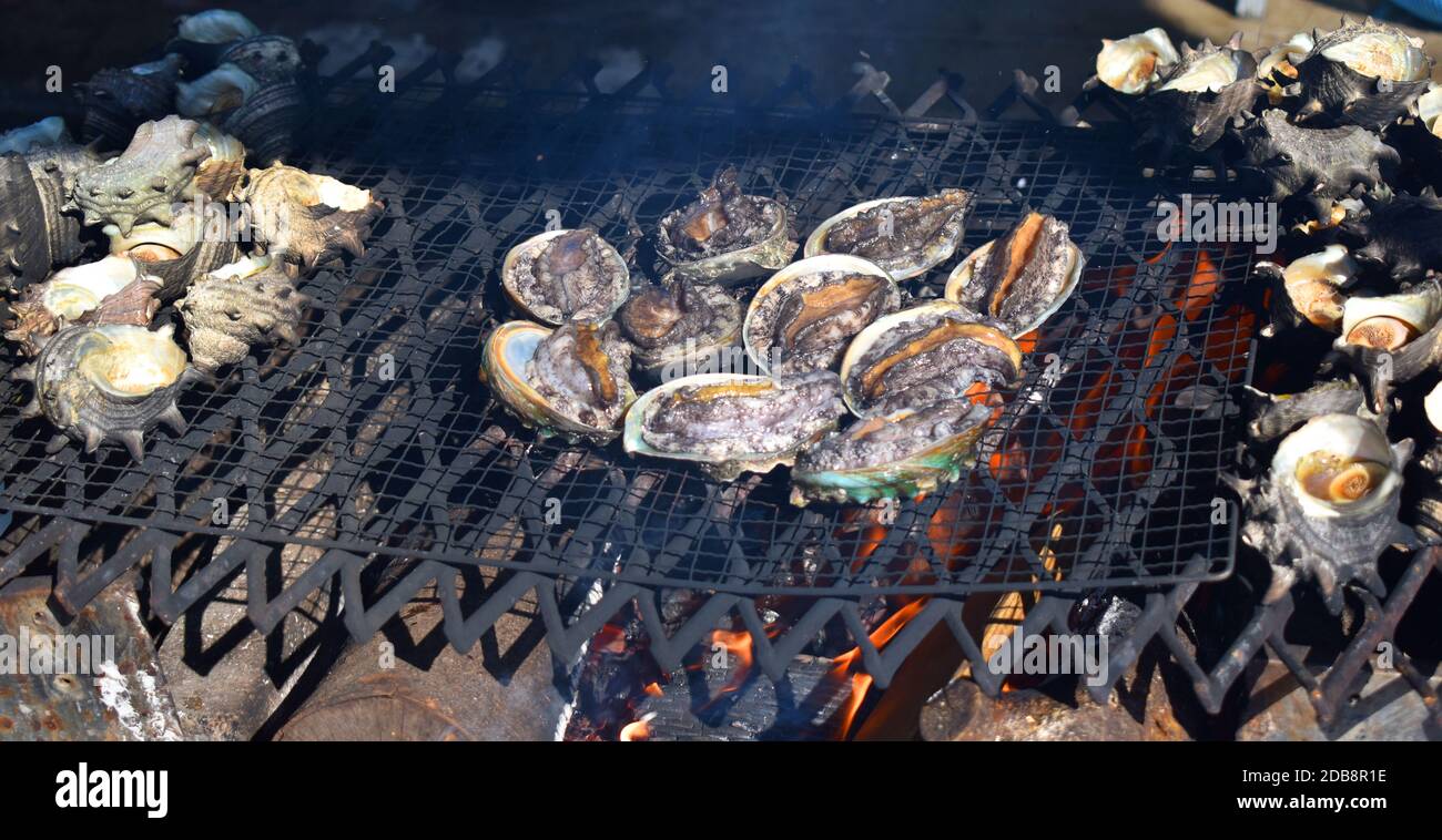 Grilled clams abalone back ground Stock Photo - Alamy