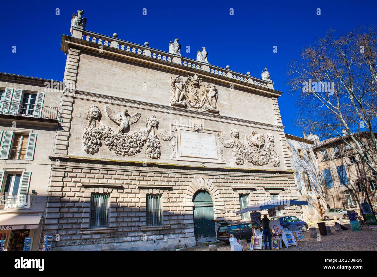 AVIGNON, FRANCE - MARCH, 2018: Artist selling his artwork next to the ...