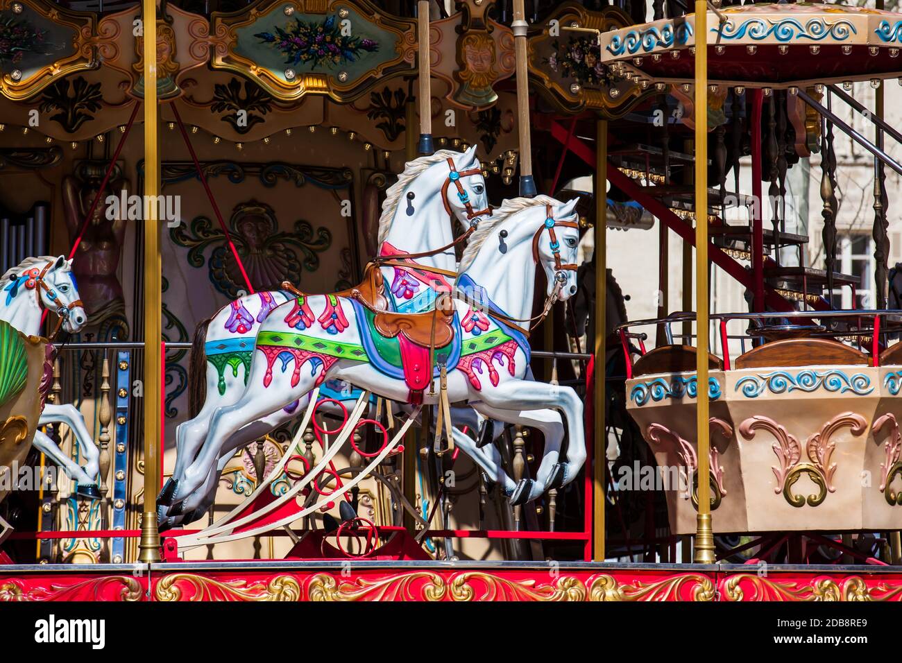 Horses of a French old-fashioned style carousel with stairs in Avignon ...