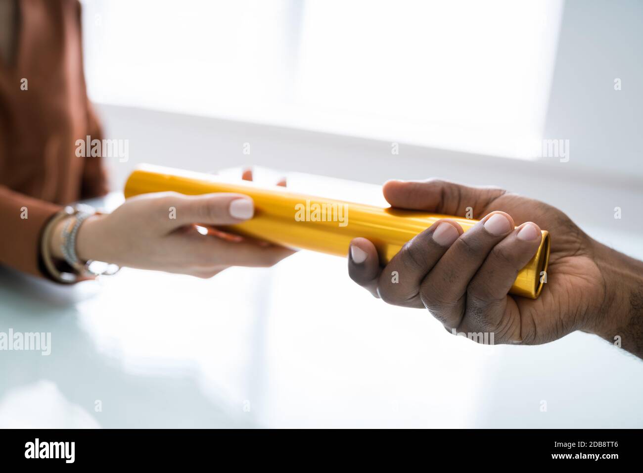 Handover baton in relay race hi-res stock photography and images - Alamy