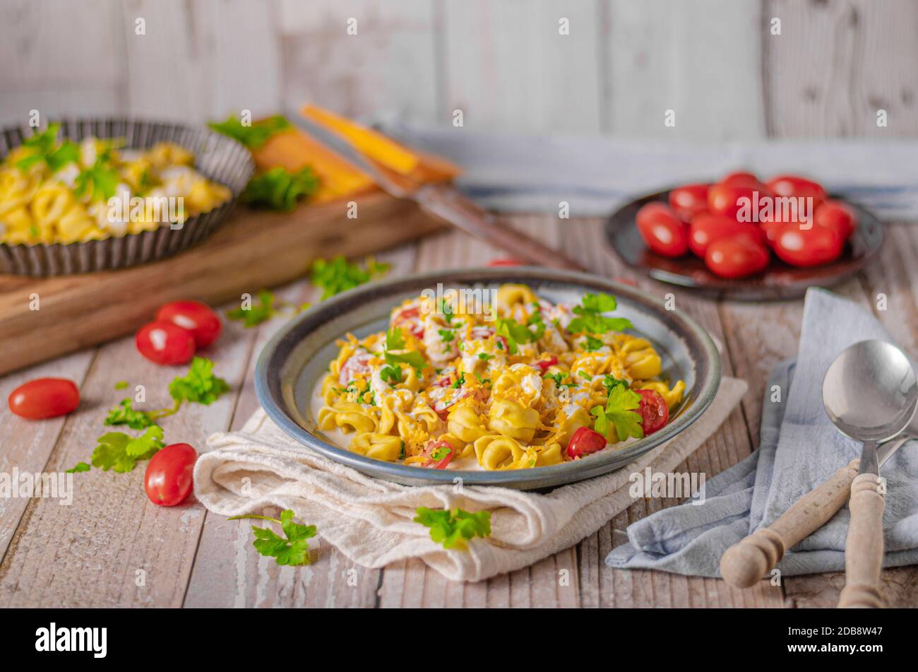 Italian tortellini with herbs and cheese sauce Stock Photo - Alamy