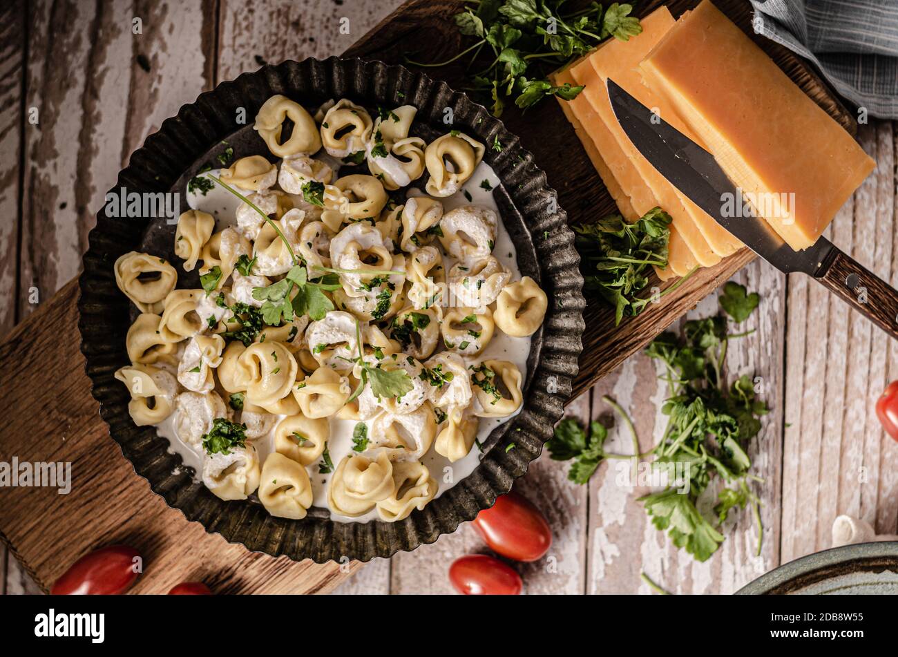 Italian tortellini with herbs and cheese sauce Stock Photo - Alamy