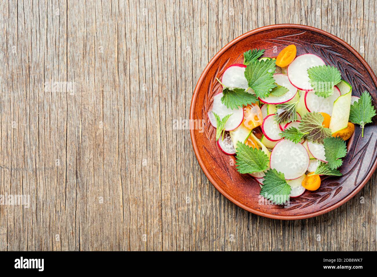 Healthy vegetable salad of nettle on plate.Healthy food concept Stock ...