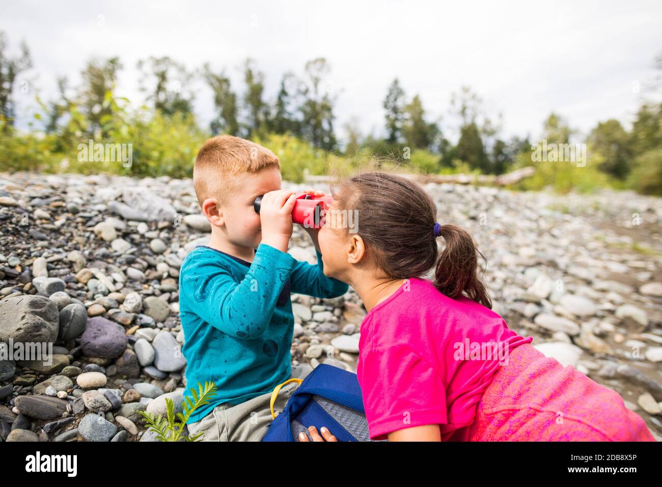 Kids having fun while playing outside Stock Photo - Alamy
