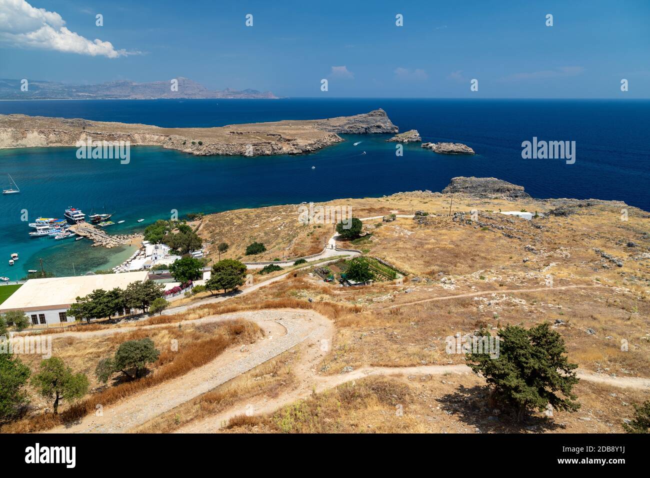 Scenic view from the acropolis on a bay and a beach with blue and ...
