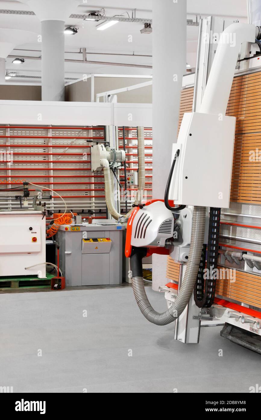 Two vertical wood panel saws machines in workshop Stock Photo - Alamy