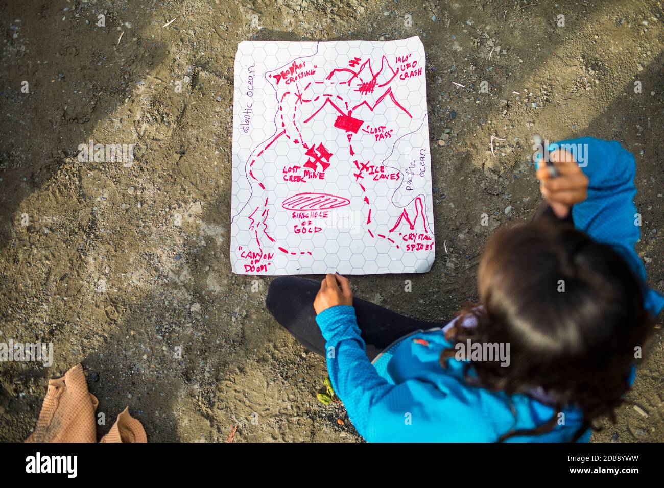 girl looks at a treasure map Stock Photo - Alamy