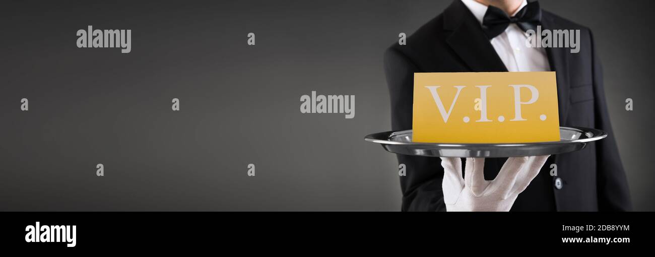 VIP Waiter Hospitality Service Staff Showing Banner Stock Photo - Alamy