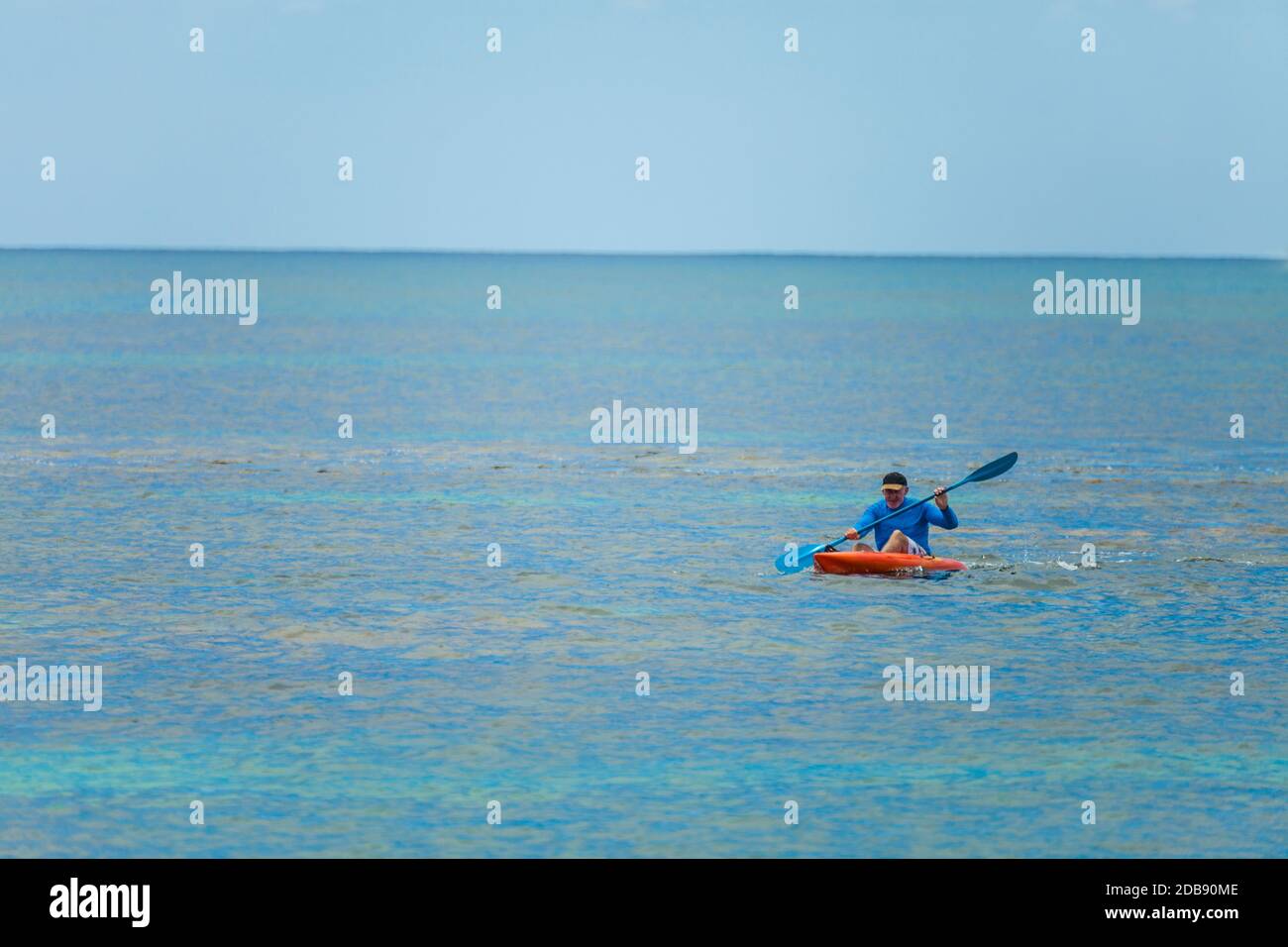 Active man paddles a wave ski in Longreach Bay, Rottnest Island ...